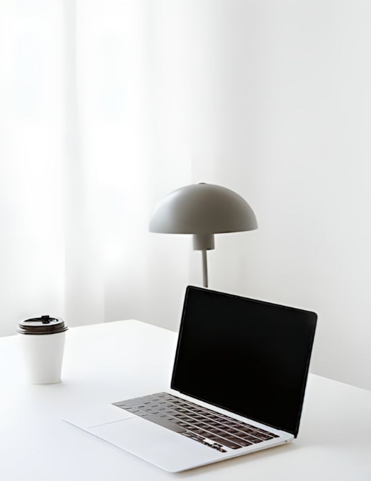 A laptop placed on a white table Template | PosterMyWall