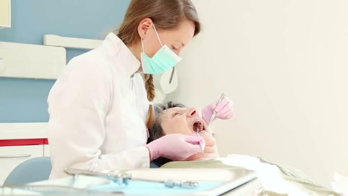 Copy of Doctor treating patient's teeth | PosterMyWall